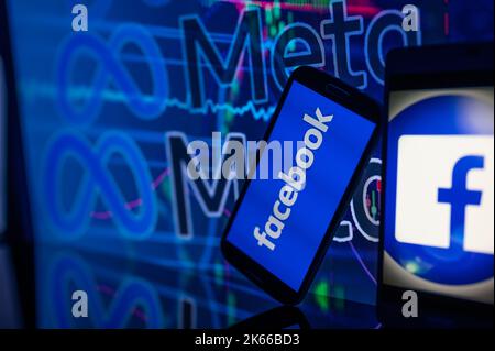 The smartphones with Facebook icon on the screen and Meta logo in the ...