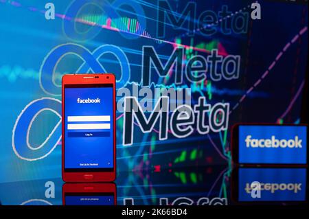 The smartphones with Facebook login screen and Meta logo in the ...