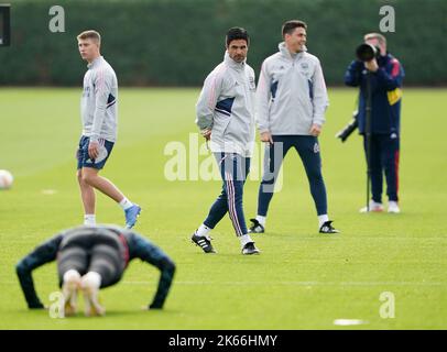 Arsenal manager Mikel Arteta (centre) and backroom staff during a ...