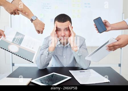 Office Environment - Frustrated overworked office worker at her desk in ...