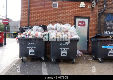 Overflowing unsorted waste bins at Costa containing many metal and ...