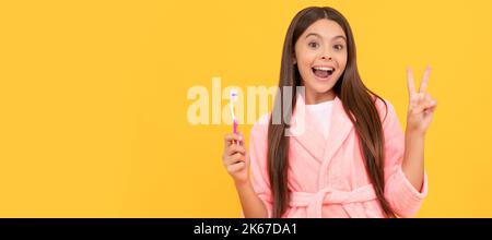 Happy teenager portrait. Teenager girl brushing her teeth over isolated ...
