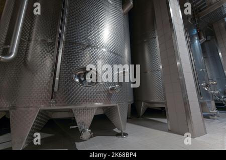 Modern wine cellar with new large inox stainless steel tanks for the ...