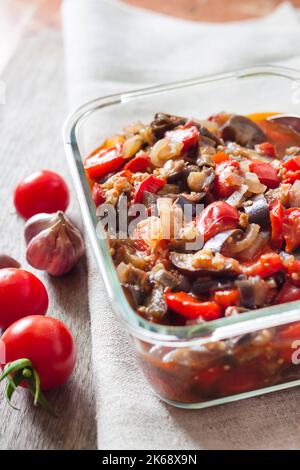 Vegetable saute of seasonal vegetables, eggplant with tomatoes on a ...