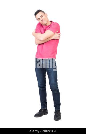 Sincere man smiling and embracing shoulders. White background Stock ...