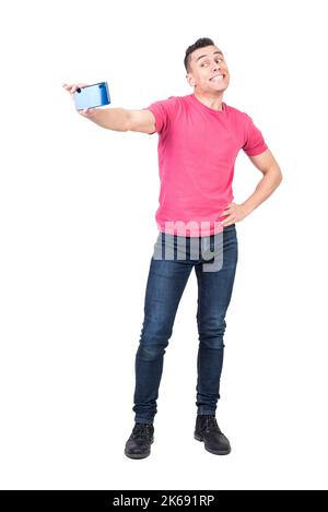 Photo of cool millennial brunet guy show thumb up wear yellow shirt ...