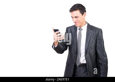 smiling businessman in formal wear standing with hand in pocket near ...