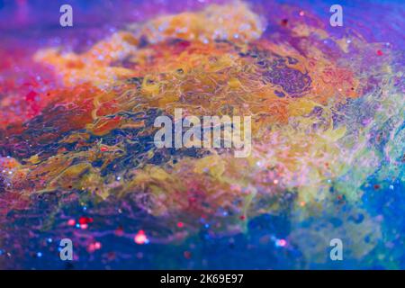 glitter pollution microplastic colorful stains on ice Stock Photo - Alamy