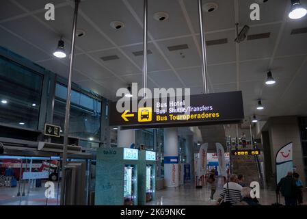 Sign at Alicante Airport directing passengers to bus area, for shuttle ...