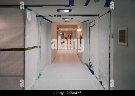 Inside of a building or hotel taped off for interior repair and ...