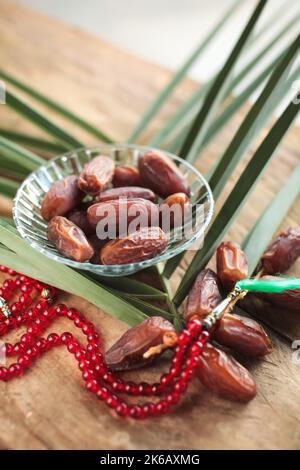 Dates or dattes palm fruit in wooden bowl is snack healthy Stock Photo ...