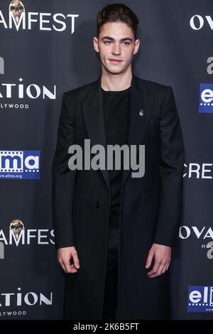 Hero Fiennes Tiffin, an English actor and model, surrounded by fans ...