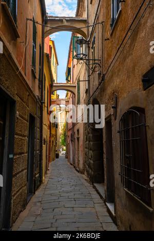 The picturesque narrow streets of Noli. Noli old town. Liguria, Italy ...