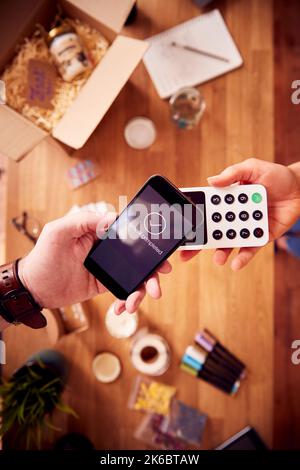 A vertical shot of two handmade candles on a table Stock Photo - Alamy