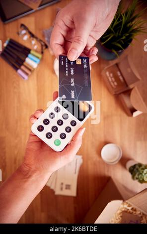 A vertical shot of two handmade candles on a table Stock Photo - Alamy