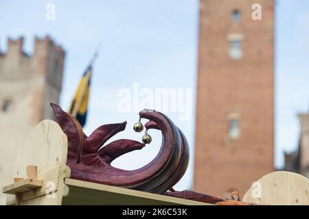Jester shoes on a medieval market bench Stock Photo - Alamy