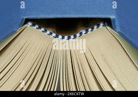 Opened book face down Stock Photo - Alamy
