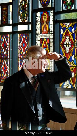 King Charles III views stain glass windows during a visit to the ...