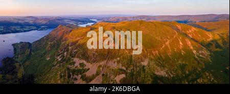 Aerial view of sunset over Ullswater lake in Lake District, a region ...