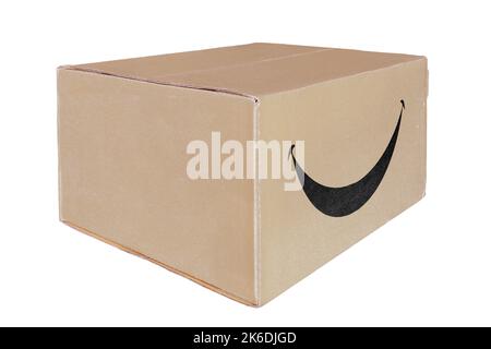 Closed cardboard box with a smile sign, isolated on a white background ...