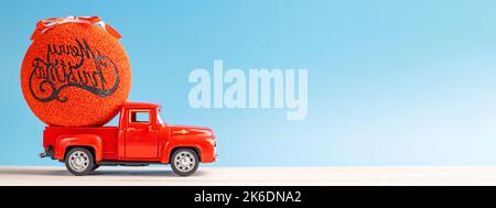 Red car with a gift box on a red background. Concept - delivery of ...