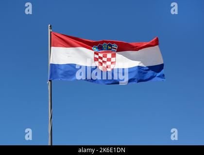 The Croatian national flag, or Tricolour, flying fully open against a ...