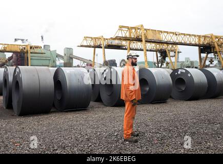 An employee at ArcelorMittal Dofasco, a manufacturer of hot rolled steel coils, parks a truck at ...