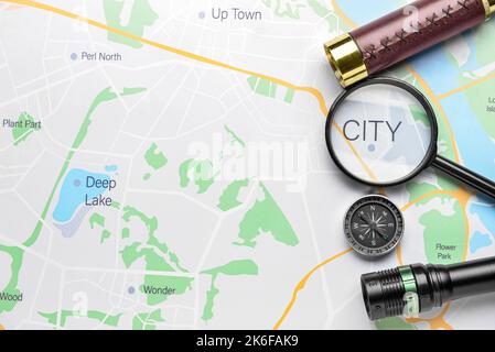 Magnifier, compass and flashlight on map. Banner for design Stock Photo ...