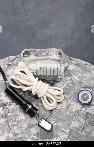 Modern flashlight with rope on dark wooden background Stock Photo - Alamy