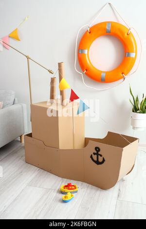 Interior of children's room with toy cardboard ship Stock Photo - Alamy