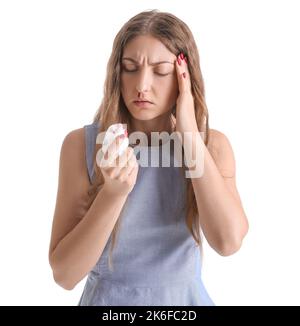 Young woman with nosebleed and tissue on white background Stock Photo ...