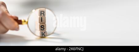Risk Detection Using Magnifying Glass. Wooded Block Word Stock Photo ...