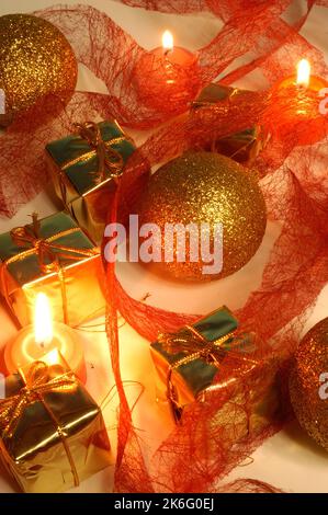 Christmas decoration with candle, christmas tree balls, fir branches ...