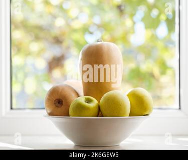 Closeup shot of two Halloween pumpkin lantern lighted up through the ...