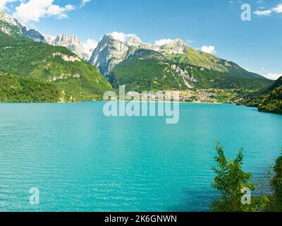 The town and lake with the same name Molveno lake nestled in the ...