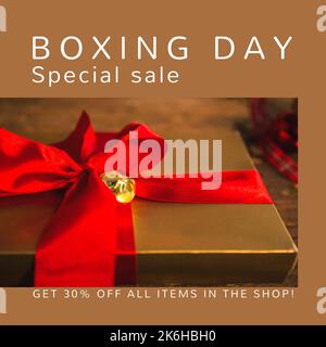 Composition of boxing day sales text over christmas decorations and ...