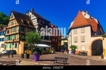 Summer cityscape of Colmar overlooking cobbled streets with typical ...