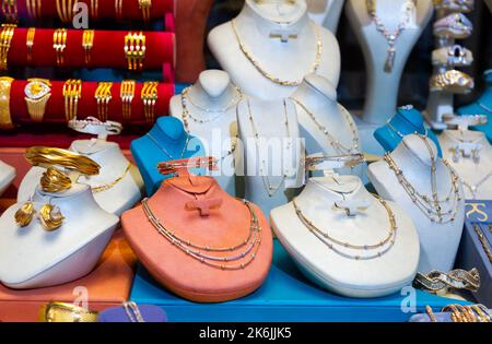 Variety of gold jewelry displayed for sale Stock Photo - Alamy