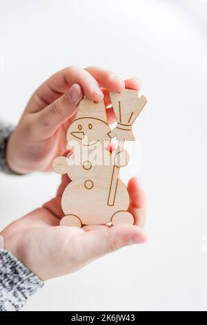 Girl makes wooden crafted Christmas ornaments at home, recyclable craft ...