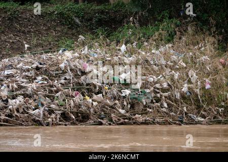 The Garbage in river stream after Waterflood Stock Photo - Alamy