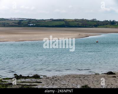 Silt on the exposed seabed at low tide. The shallow sea bay Stock Photo ...