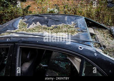 Aftermath of massive Russian missile attacks, an office building near ...