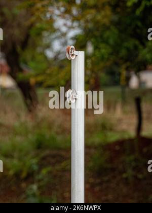 pulley on a metal pole to extend net on volleyball court Stock Photo ...