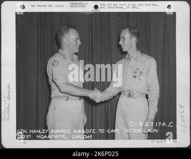Major General Thomas J. Hanley, Jr., congratulates Colonel Donald D ...