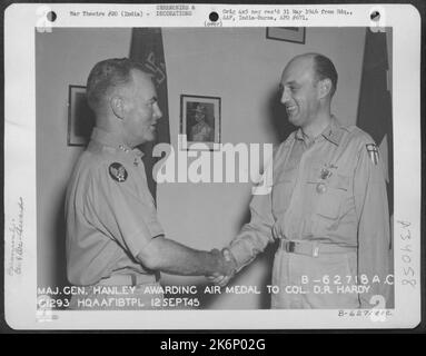 Major General Thomas J. Hanley, Jr., congratulates Colonel Donald D ...