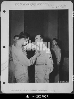 Lt. Col. Boebel of the First Air Commando Group distributing ...