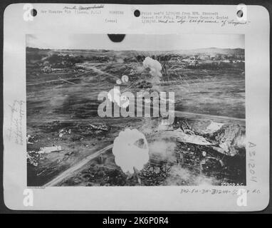Parachute bombs falling on Clark Field in the Philippines during the ...