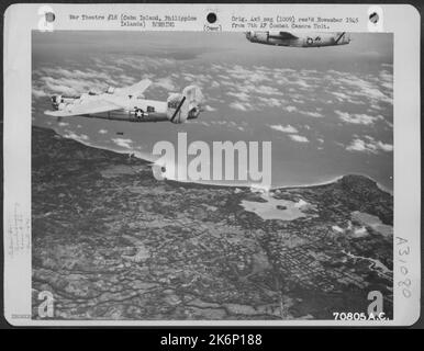 Consolidated B-24 "Liberators" of the 494th Bomb Group, fly high over ...