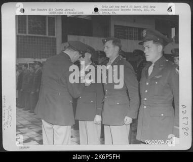 Col. Elliott Roosevelt presents an award to Lt. Silverman of the 90th ...