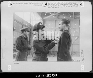 Major General Lewis H. Brereton presenting T/Sgt. Albert S. Fisher ...